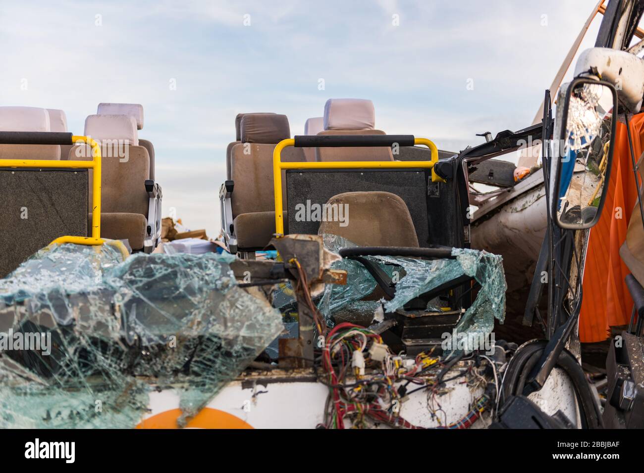Detail of a crashed bus with no roof and broken front glass Stock Photo ...