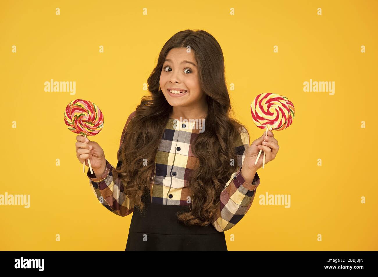 Harmful food. Crazy about sweets. Sugar addiction. Happy kid with sweet ...