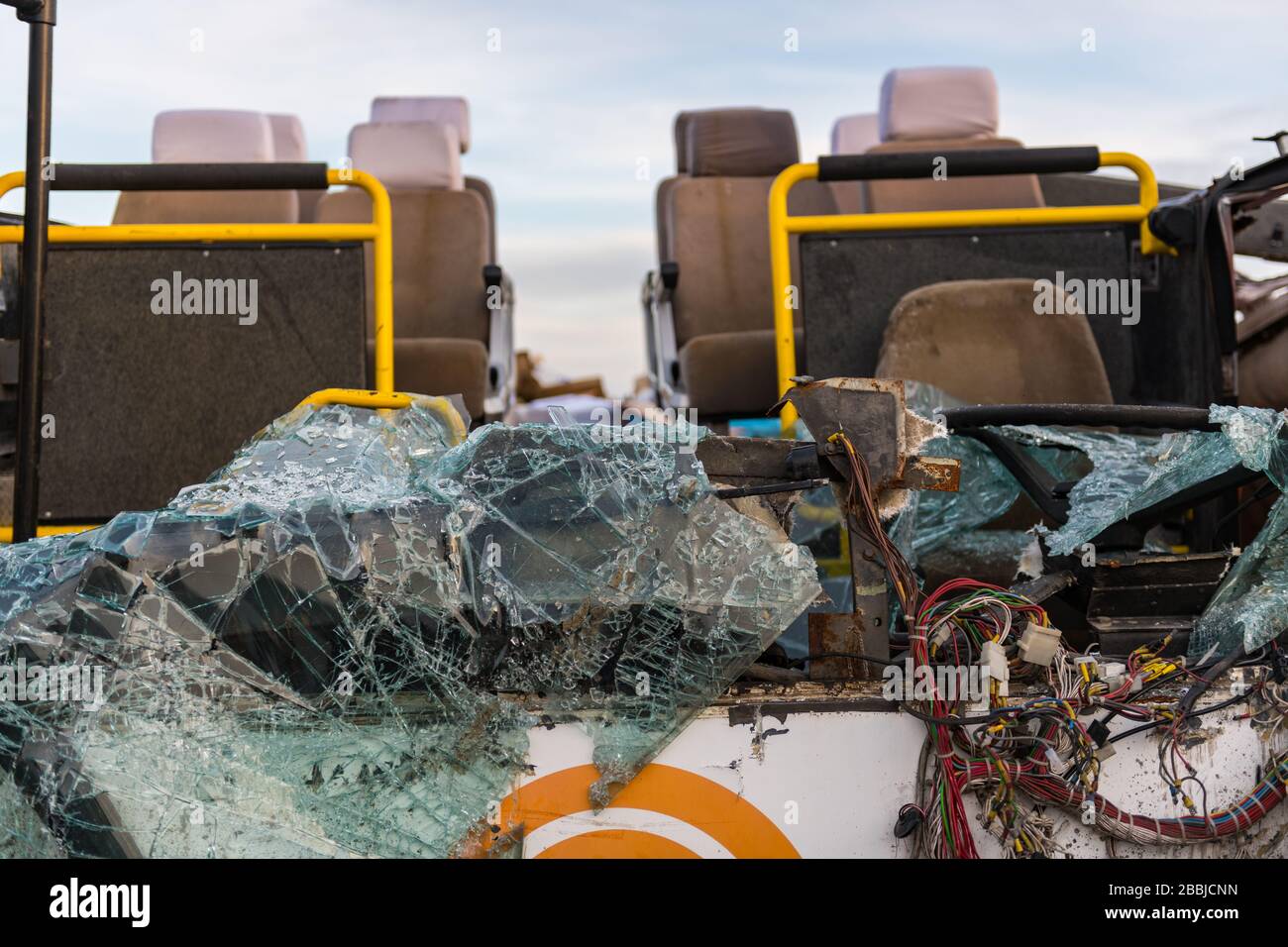 Detail of a crashed bus with no roof and broken front glass Stock Photo ...