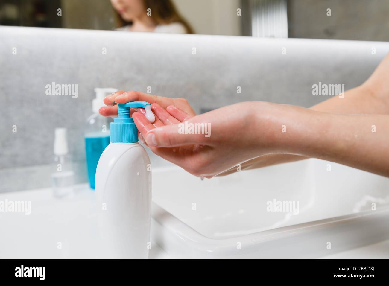 Close up liquid soap drop from dispenser Stock Photo - Alamy