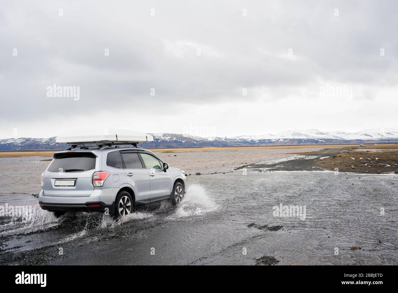 Car crossing stream in Iceland Stock Photo - Alamy