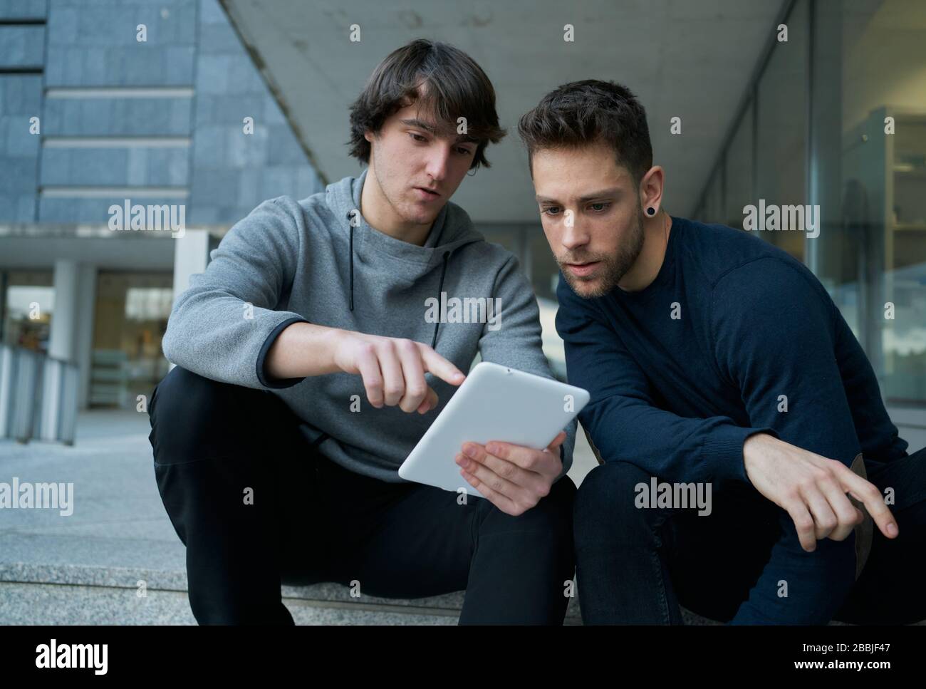 Two men sitting talking on hi-res stock photography and images - Alamy