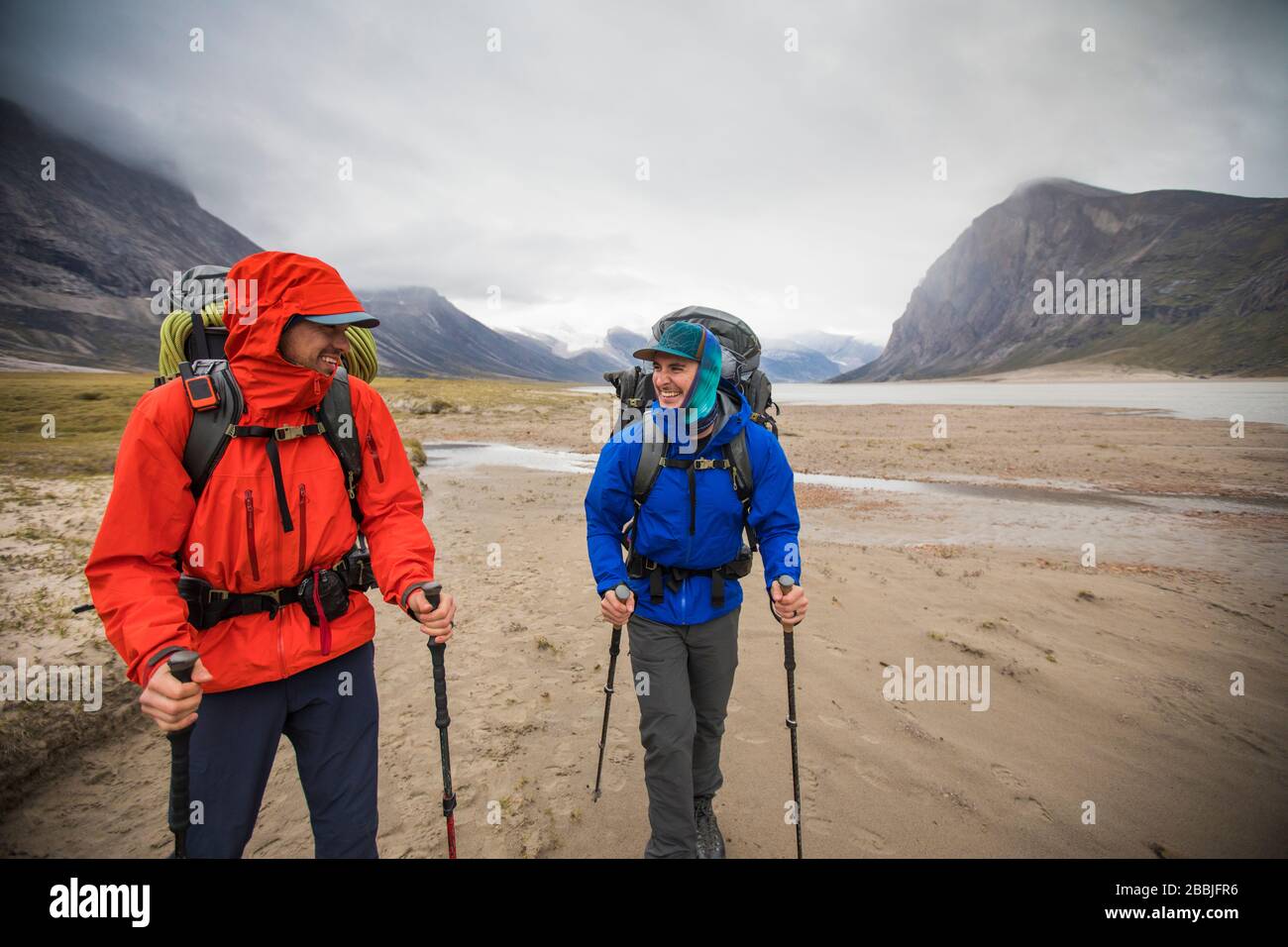 Two backpackers enjoy hiking in remote location, Baffin Island Stock ...