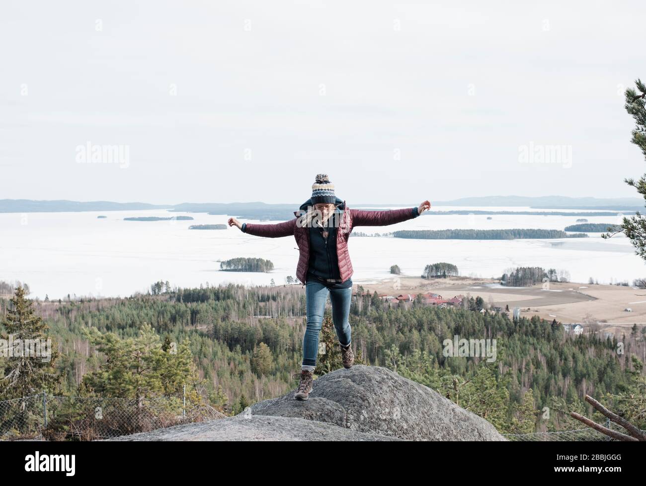 Woman hiking to the top of a mountain hi-res stock photography and ...