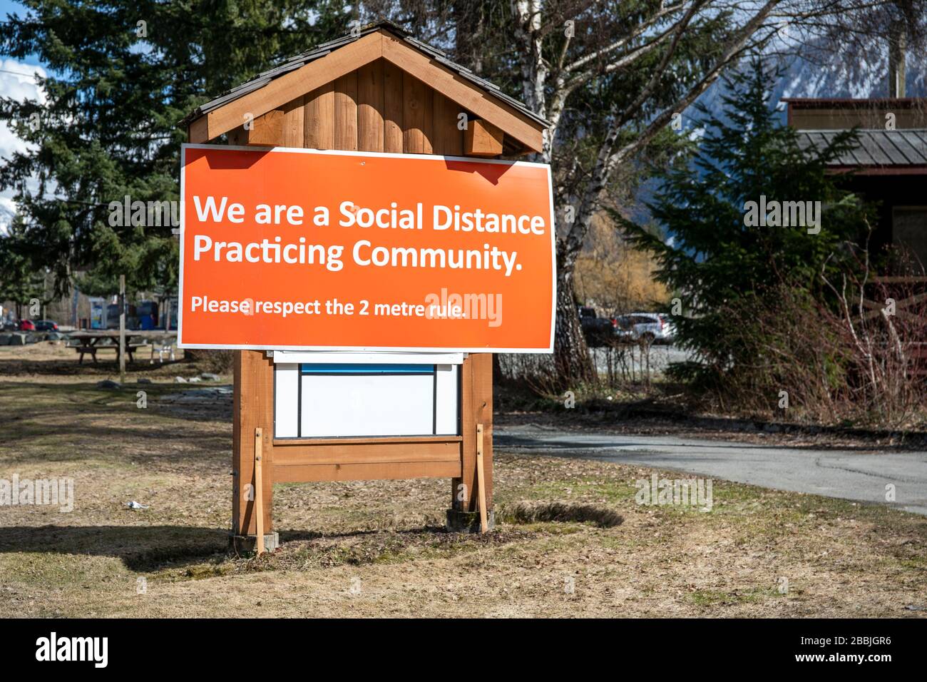 A sign states the importance of Social Distancing and the 2 meter rule ...