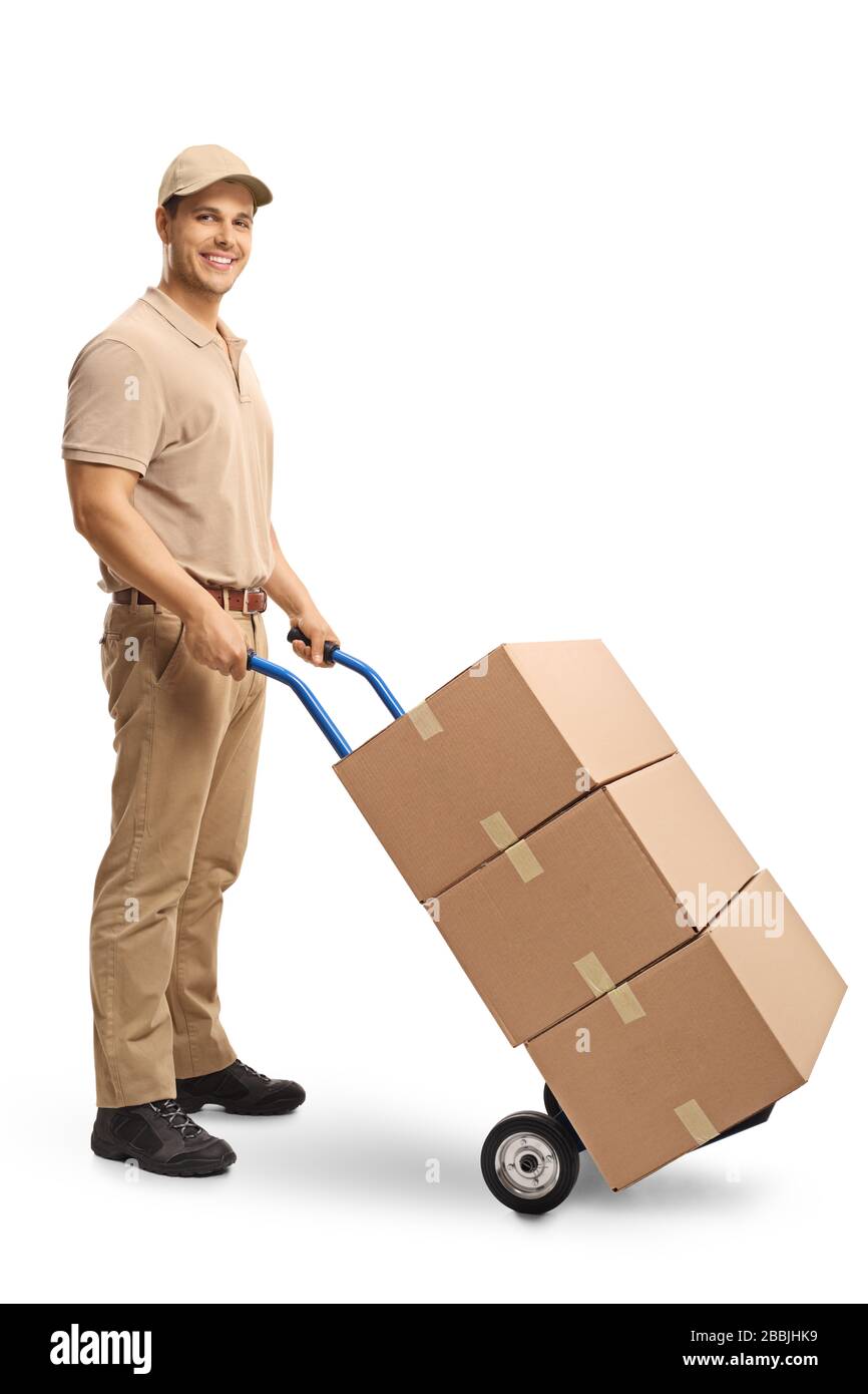 Full length shot of a delivery man pushing a hand truck with boxes ...