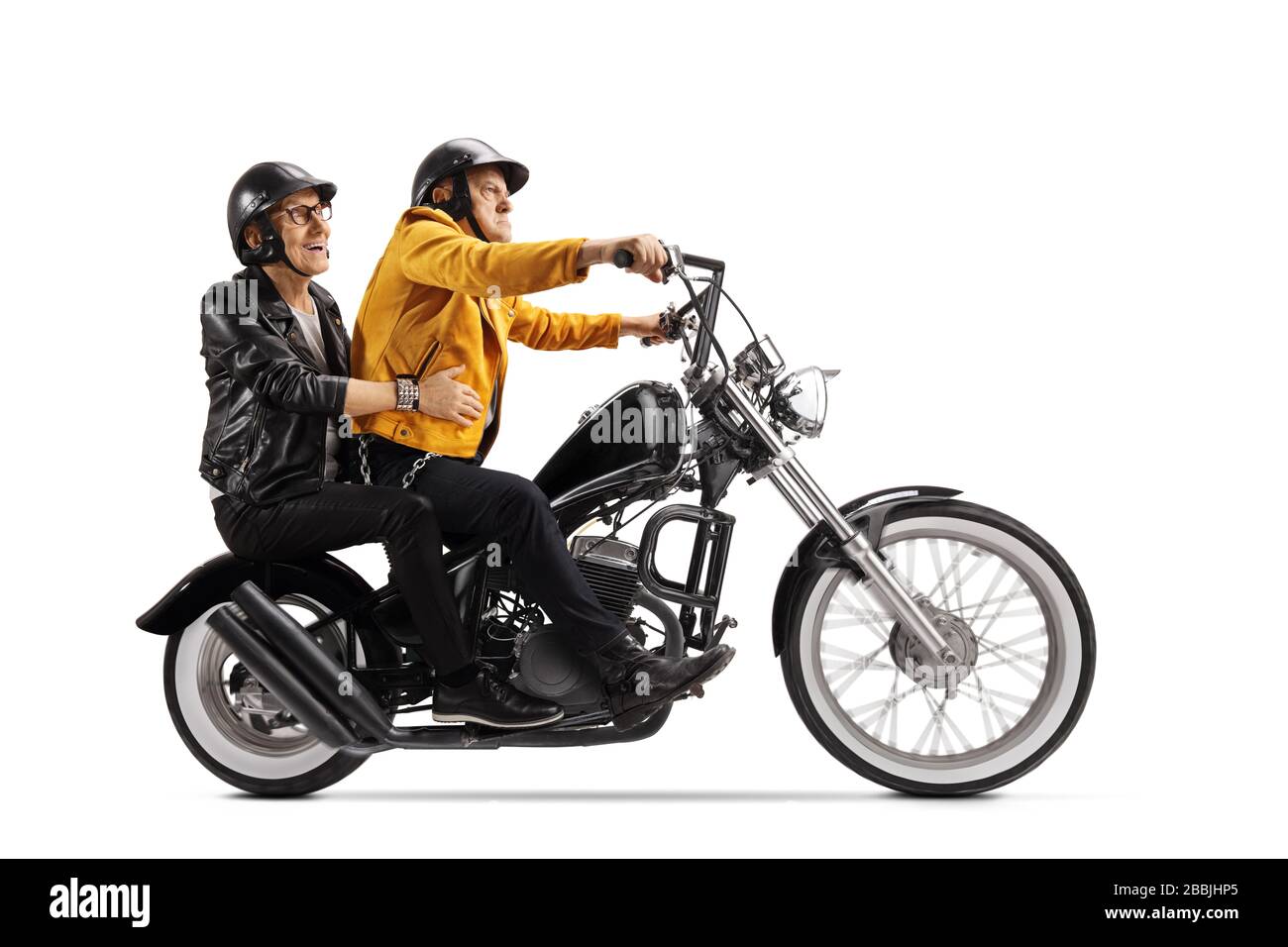 Two senior men riding on a chopper motorbike isolated on white ...