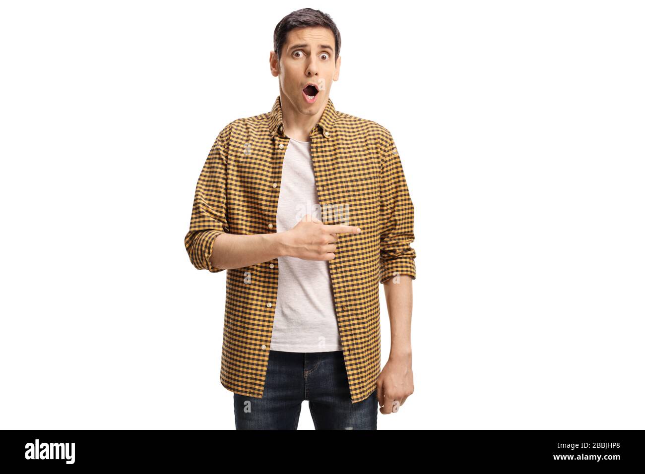 Shocked young man pointing to the side isolated on white background ...