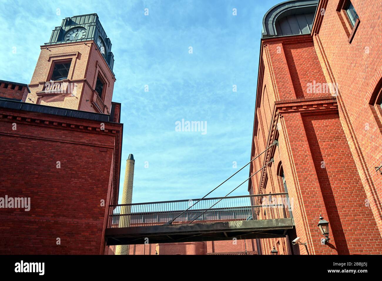 red-brick buildings and clock tower of an old brewery in the city of ...