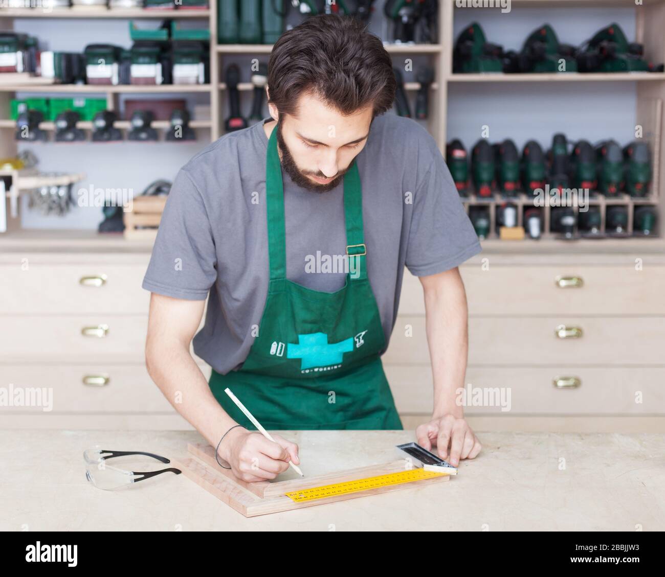 Bearded woodworker in apron work hi-res stock photography and images ...