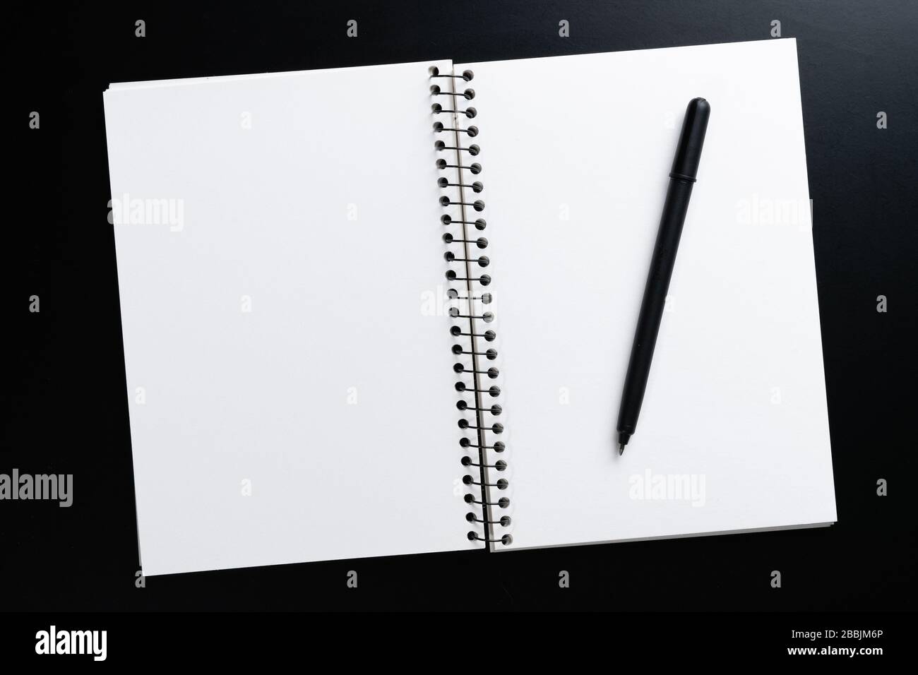 Black style set: notepad and pen on Black background Stock Photo - Alamy