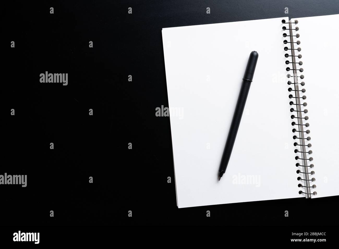 Black style set: notepad and pen on Black background Stock Photo - Alamy