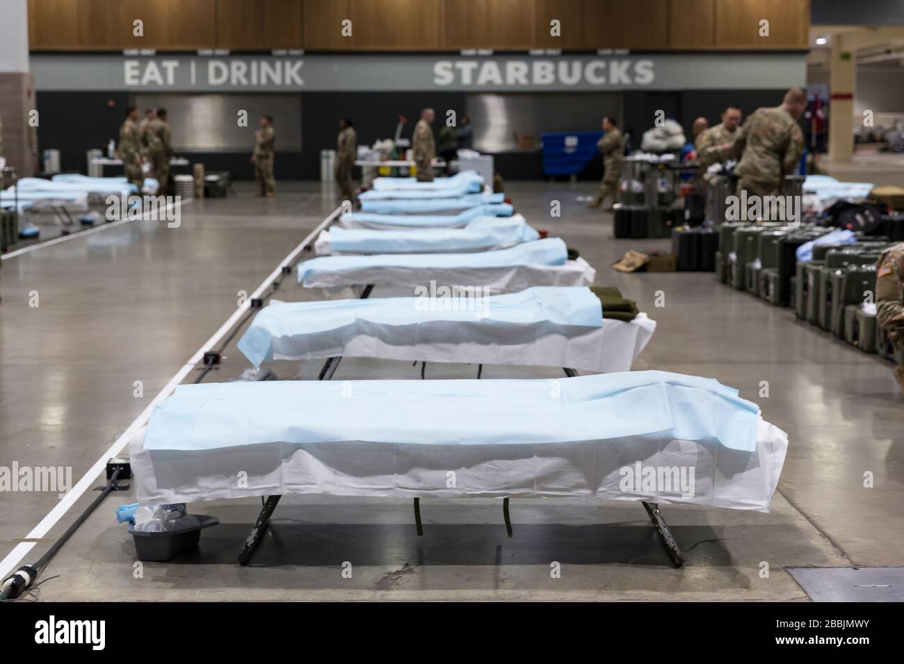 Rows of hospital beds are lined up at the field hospital in CenturyLink ...