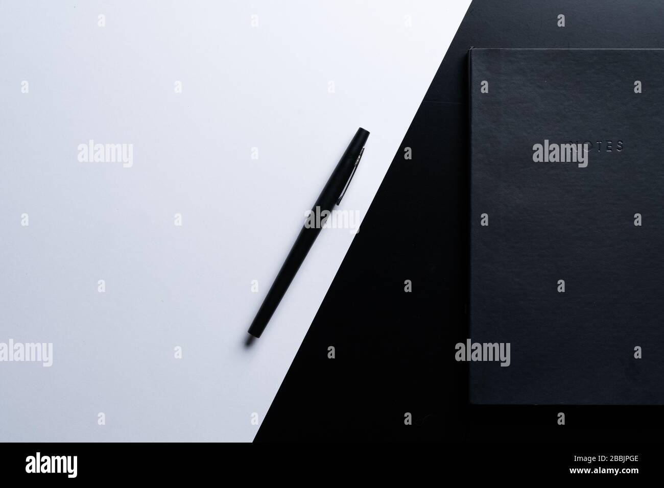 Black style set: notepad and pen on Black background Stock Photo - Alamy
