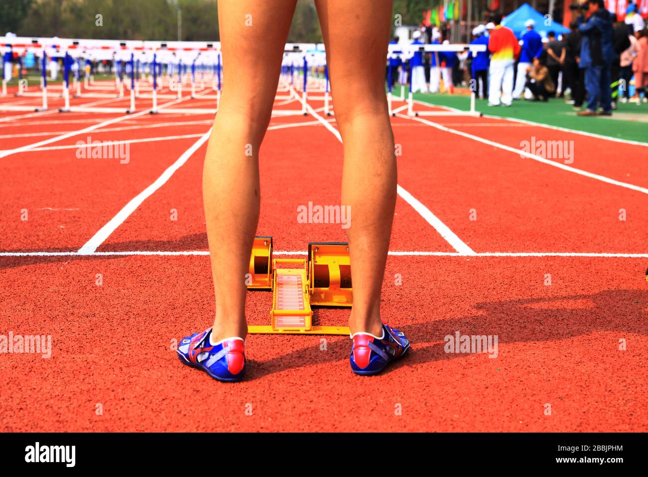 The athletes are at the starting line of the stadium Stock Photo - Alamy