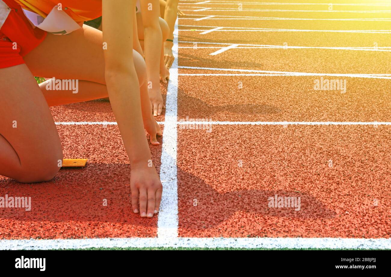The athletes are at the starting line of the stadium Stock Photo - Alamy
