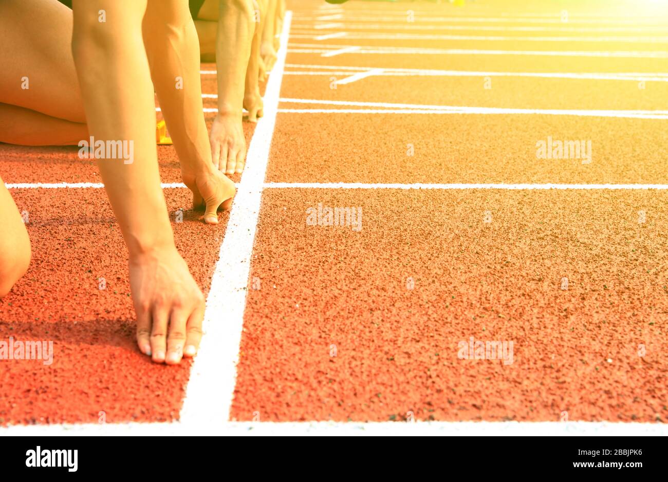 The athletes are at the starting line of the stadium Stock Photo - Alamy