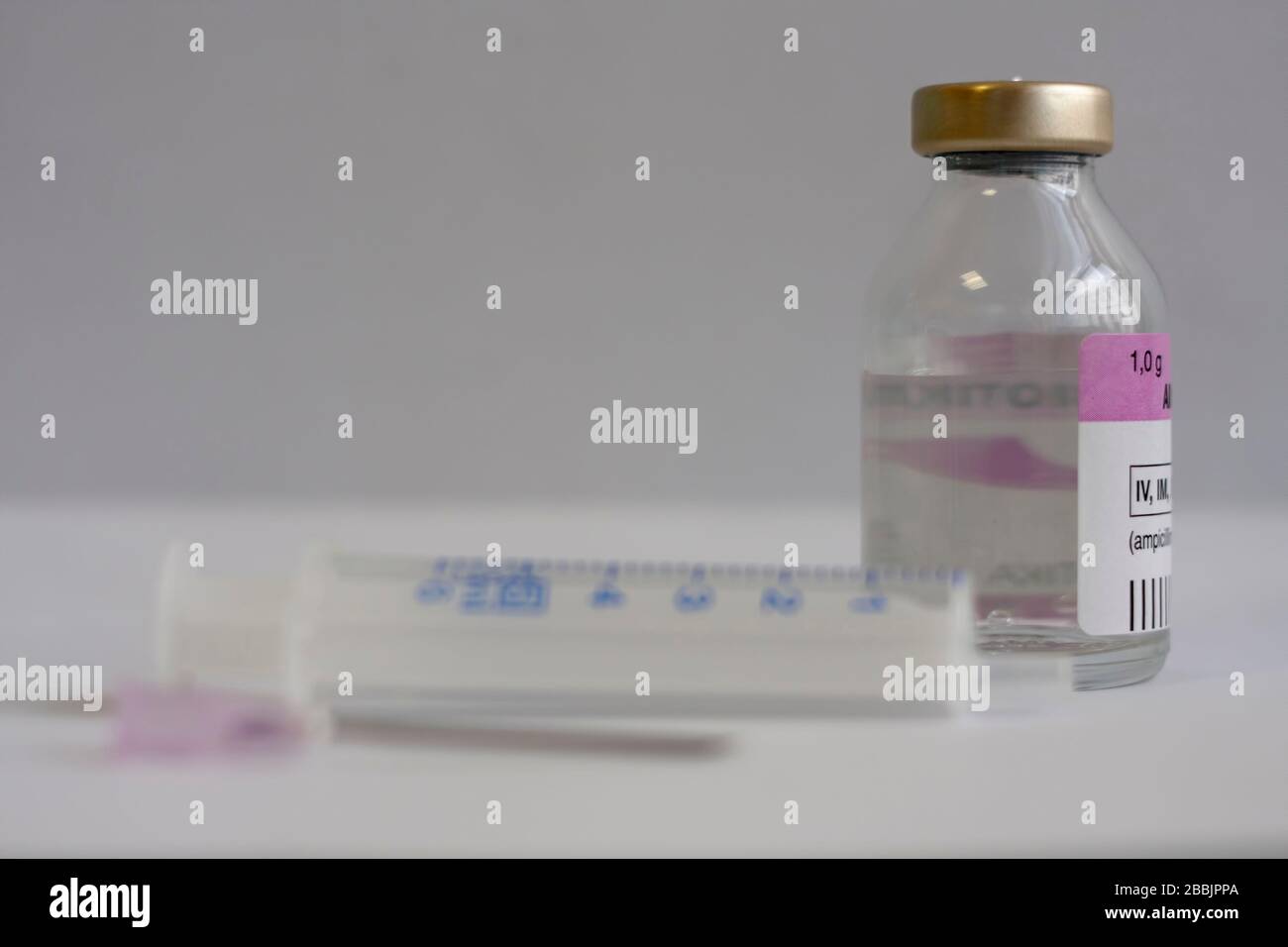 Vial of antibiotics with syringe and needle , injection drugs used in ...