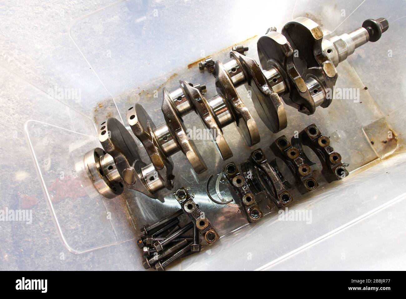 Car engine crankshaft in clear plastic tub awaiting installation Stock ...