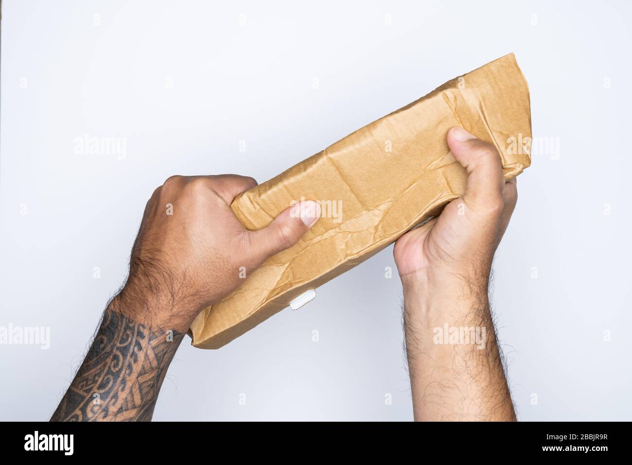 Man hand grab and twist Crate paper for recycle. Eco system Stock Photo ...