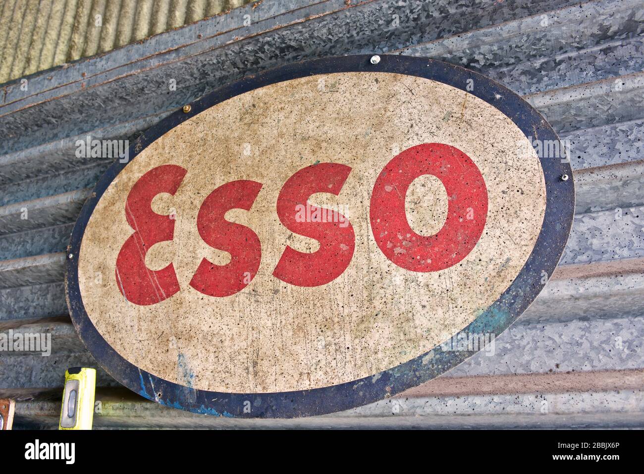 Old Esso Petroleum enamel sign, heavily patinated, mounted on ...