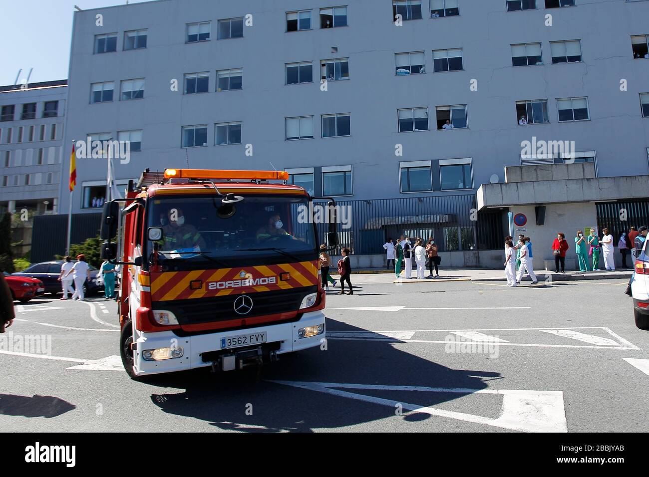 A Coruna-Spain.Firefighters with masks inside fire trucks during a ...