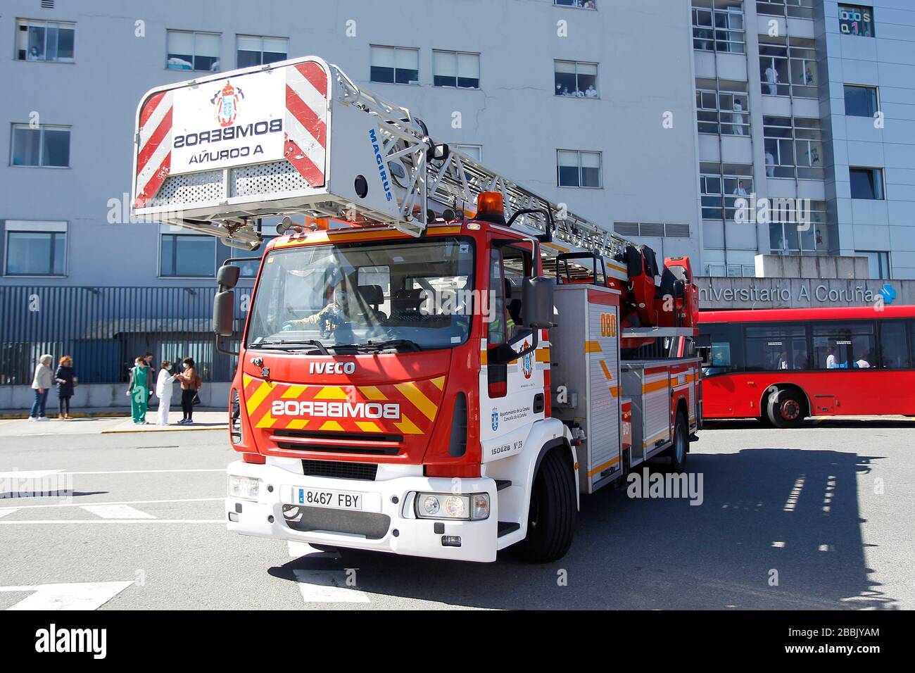 A Coruna-Spain.Firefighters with masks inside fire trucks during a ...