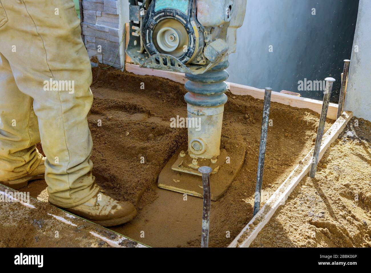 Vibratory hammer, jumping jack machine small plate compactor on urban ...