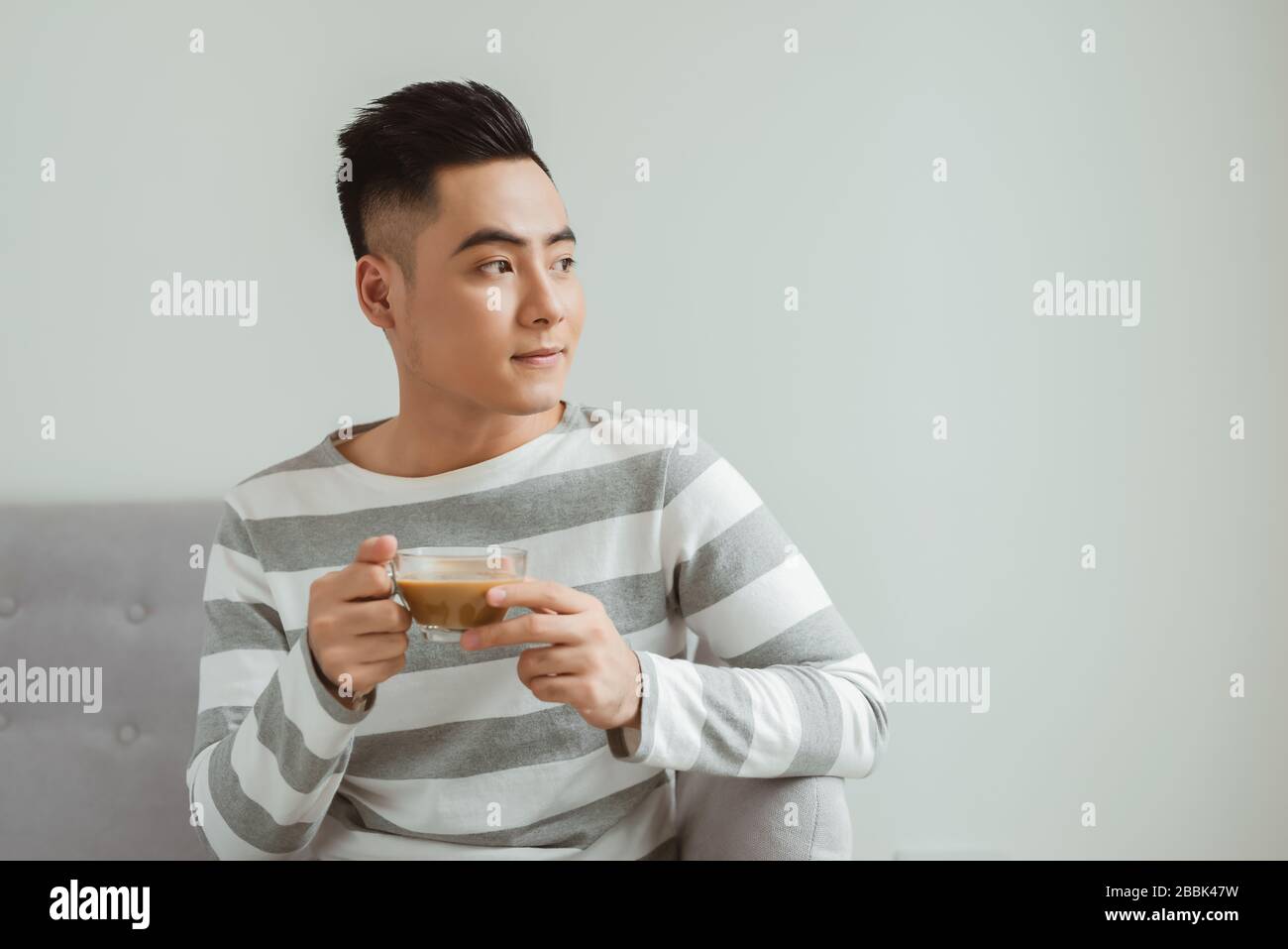 Asian man drinking coffee hi-res stock photography and images - Alamy