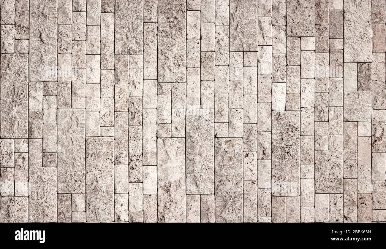 Texture of stone wall, square yellow travertine tile Stock Photo - Alamy
