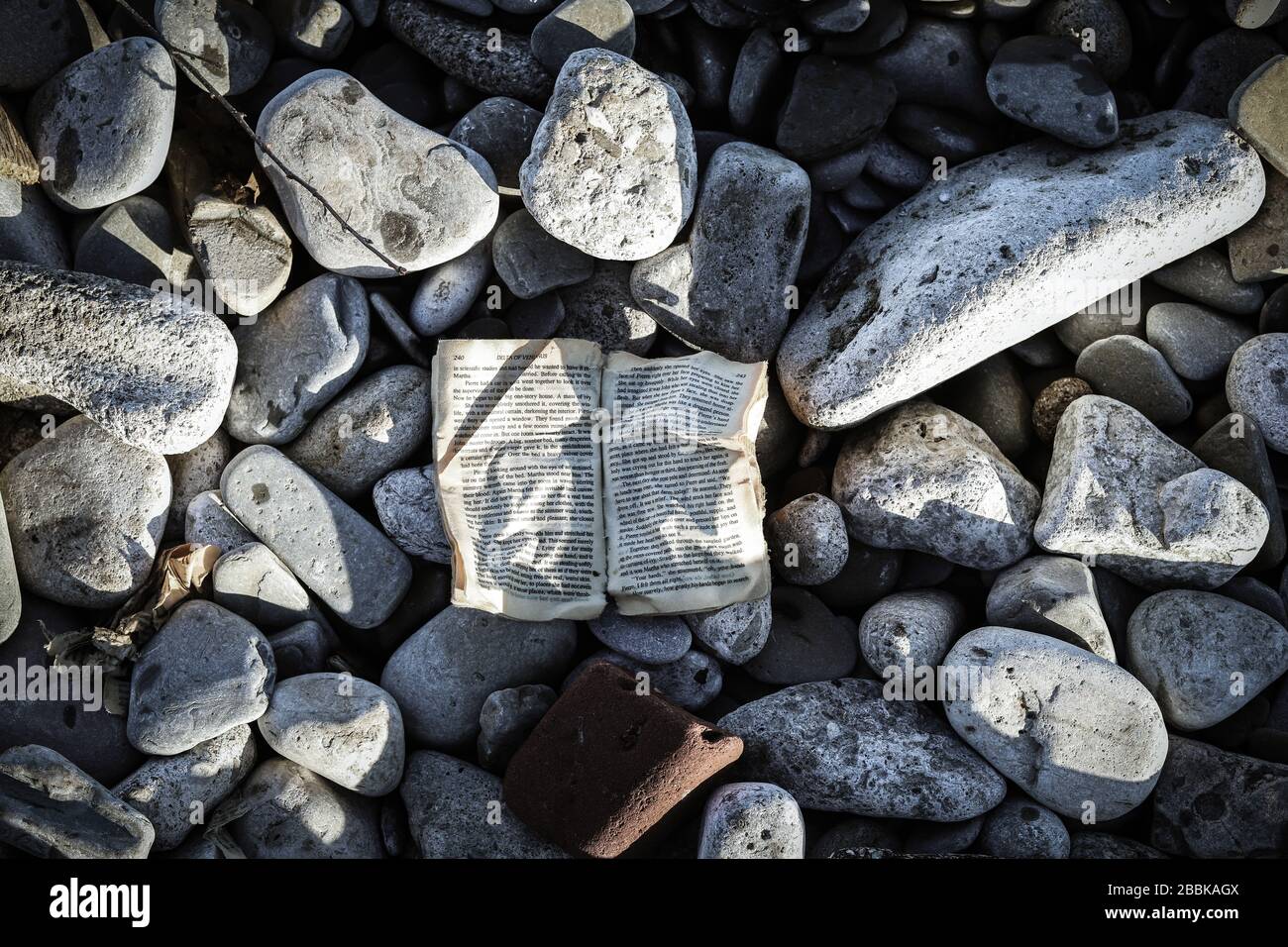 granite science - old book on stones background Stock Photo - Alamy