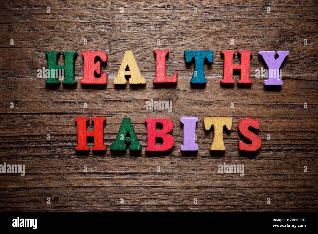 Healthy habits sentence on a wood table Stock Photo - Alamy