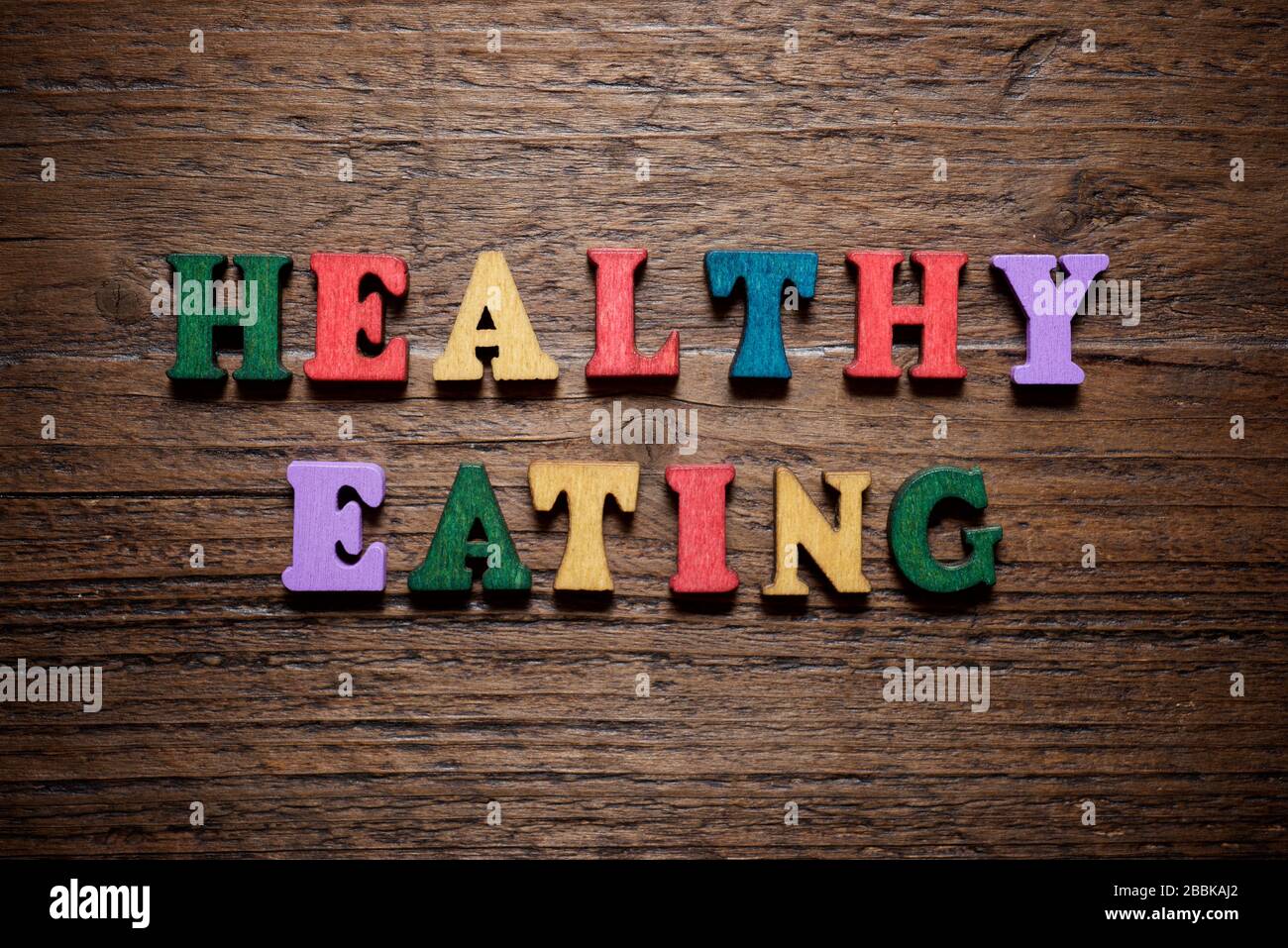 Healthy eating sentence on a wood table Stock Photo - Alamy