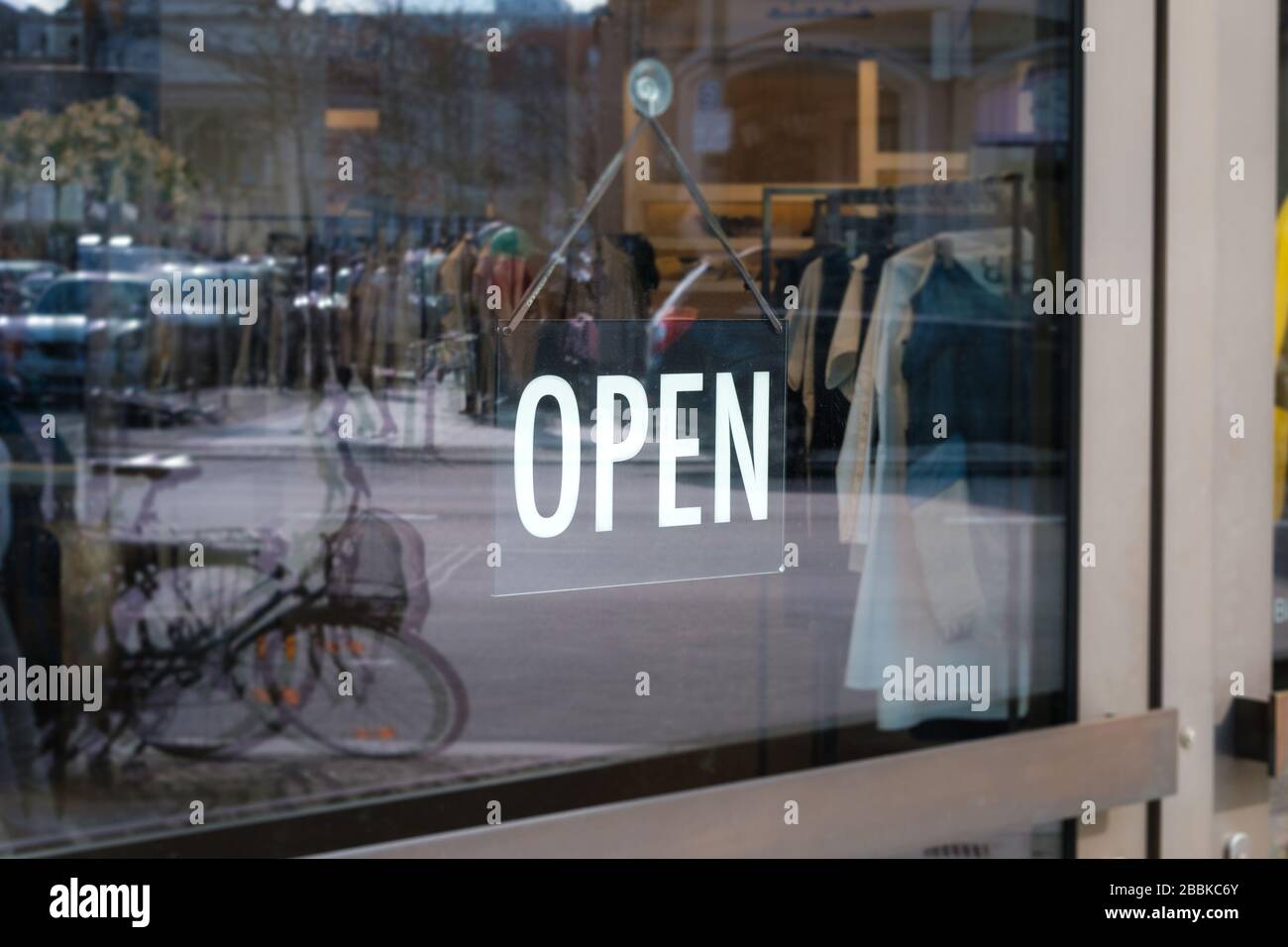 we are open sign on shop door - store window with open sign Stock Photo ...