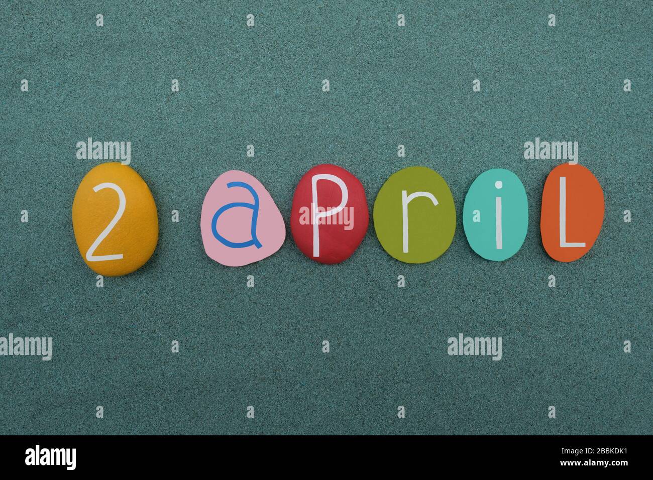 2 April, calendar date composed with colored and carved stones over ...