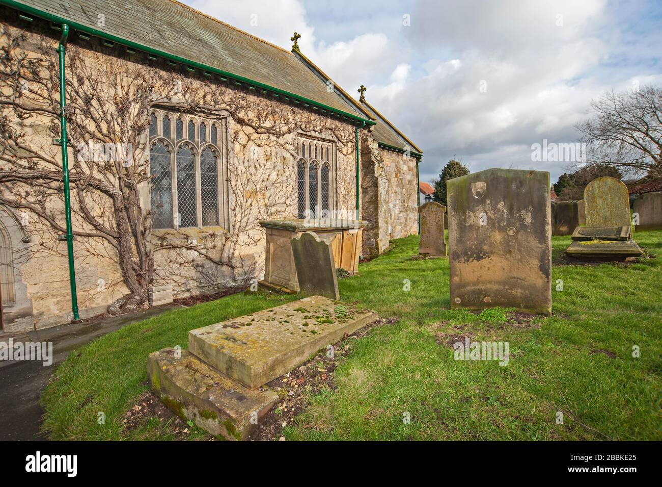 Old church and graveyard in an english rural countryside community ...