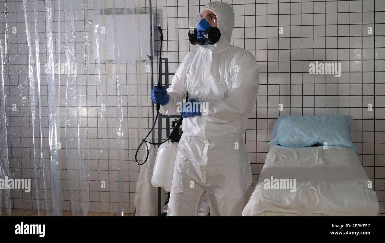 Coronavirus pandemic - Cleaning and Disinfection. Spraying room in the ...