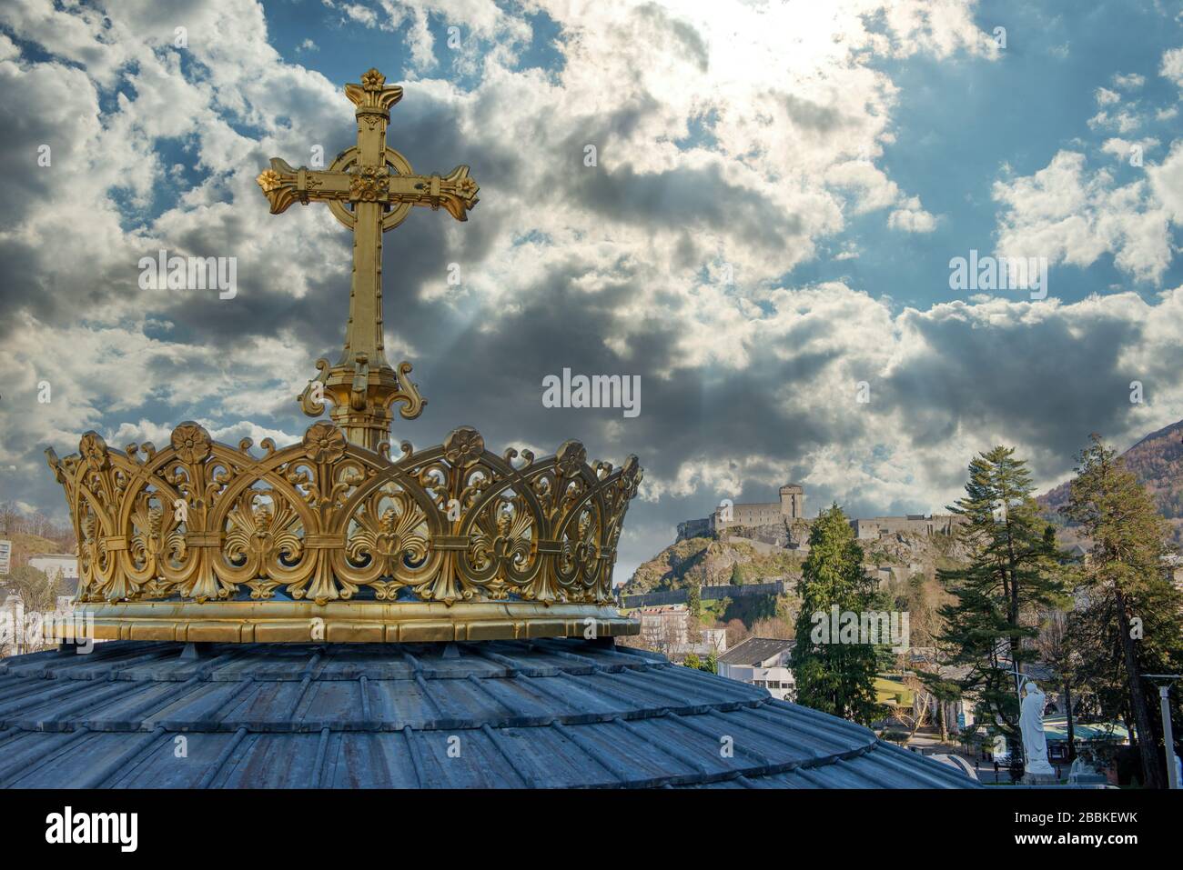 Golden cross and crown in Lourdes, France, Hautes Pyrenees. Basilica of ...