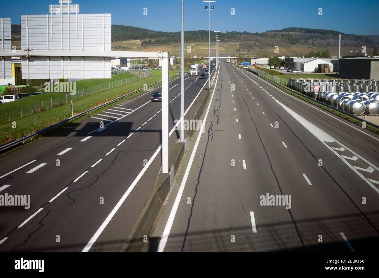 Industrial landscape with not busy motorway, the mountains in the ...