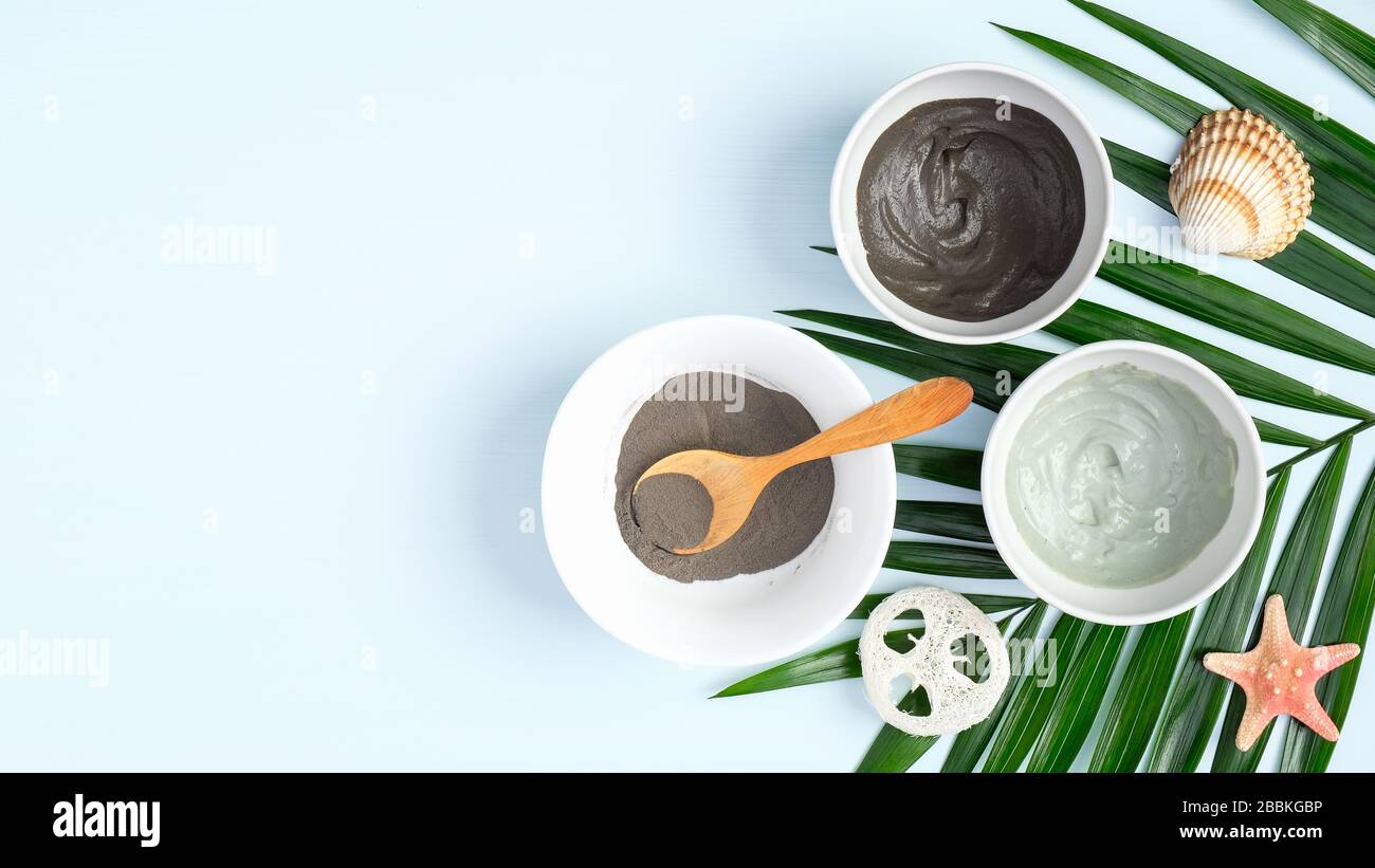 Top view facial clay mask and tropical leaf. Natural organic SPA ...