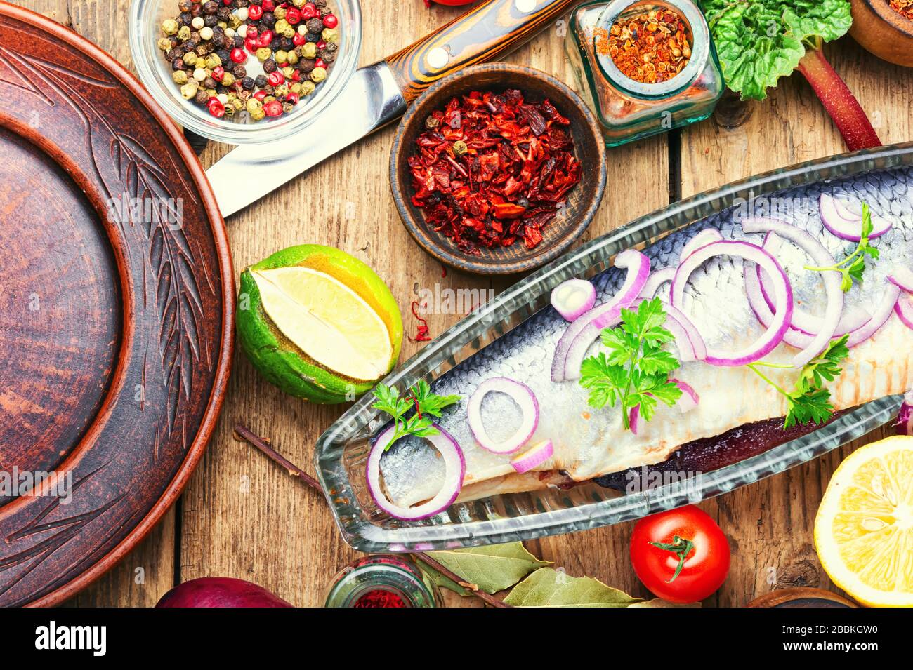 Salted herring with red onion on old wooden background.Rustic food ...