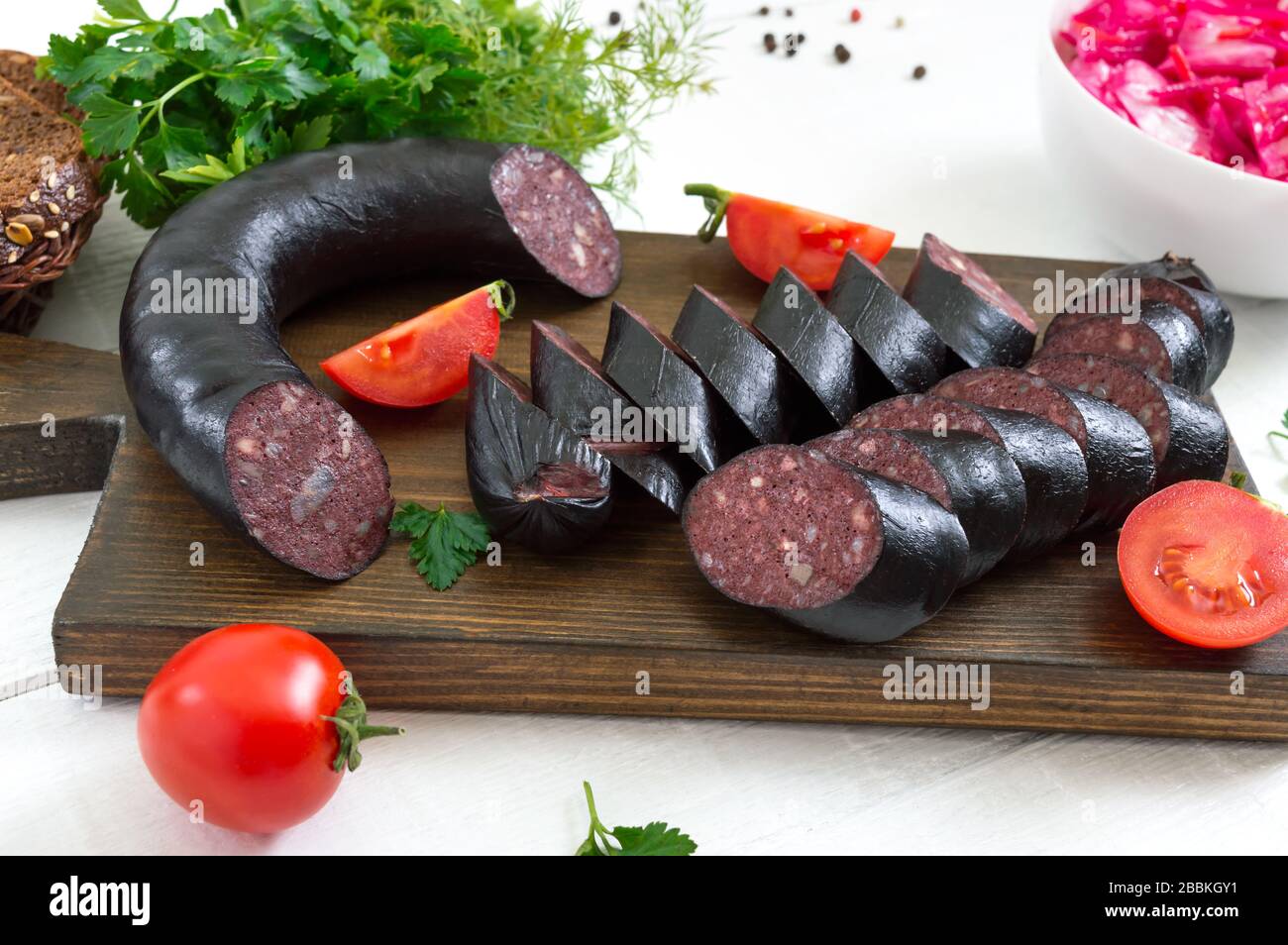 Morsilla - blood sausage. Pieces of Spanish black pudding on a wooden ...