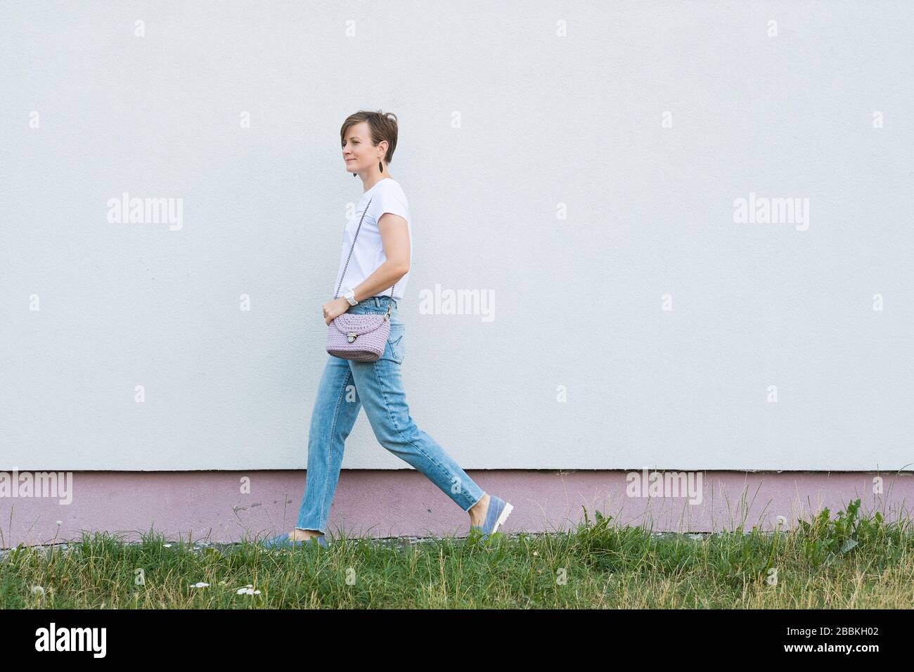 Outdoor full body portrait of young beautiful fashionable woman Stock ...