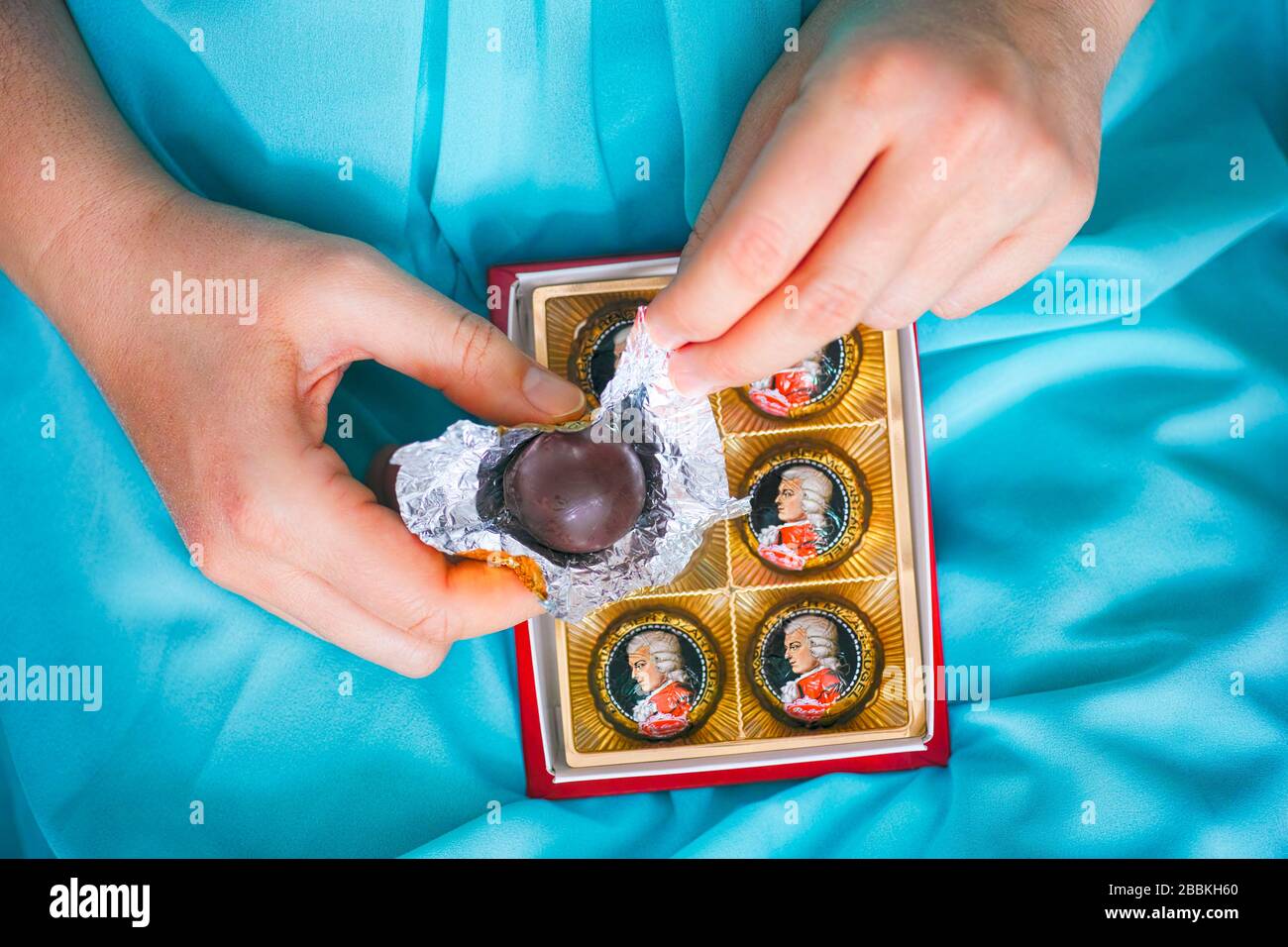 Tambov, Russian Federation - February 14, 2020 Woman hands open Mozart ...