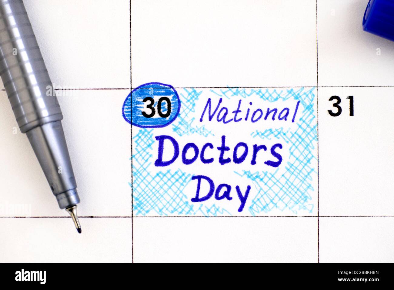 Reminder National Doctors Day in calendar with blue pen. March 30 Stock ...