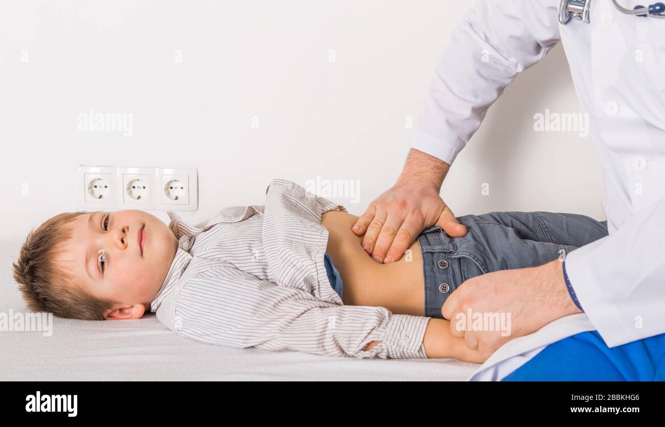 The doctor examines the belly child at clinic Stock Photo - Alamy