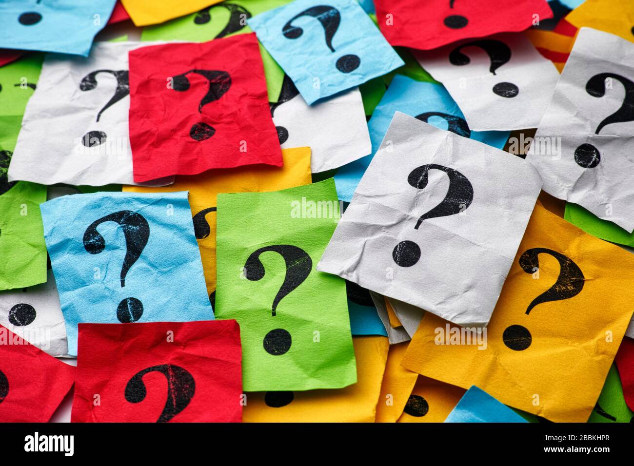 Heap of colorful paper notes with question marks. Closeup Stock Photo ...