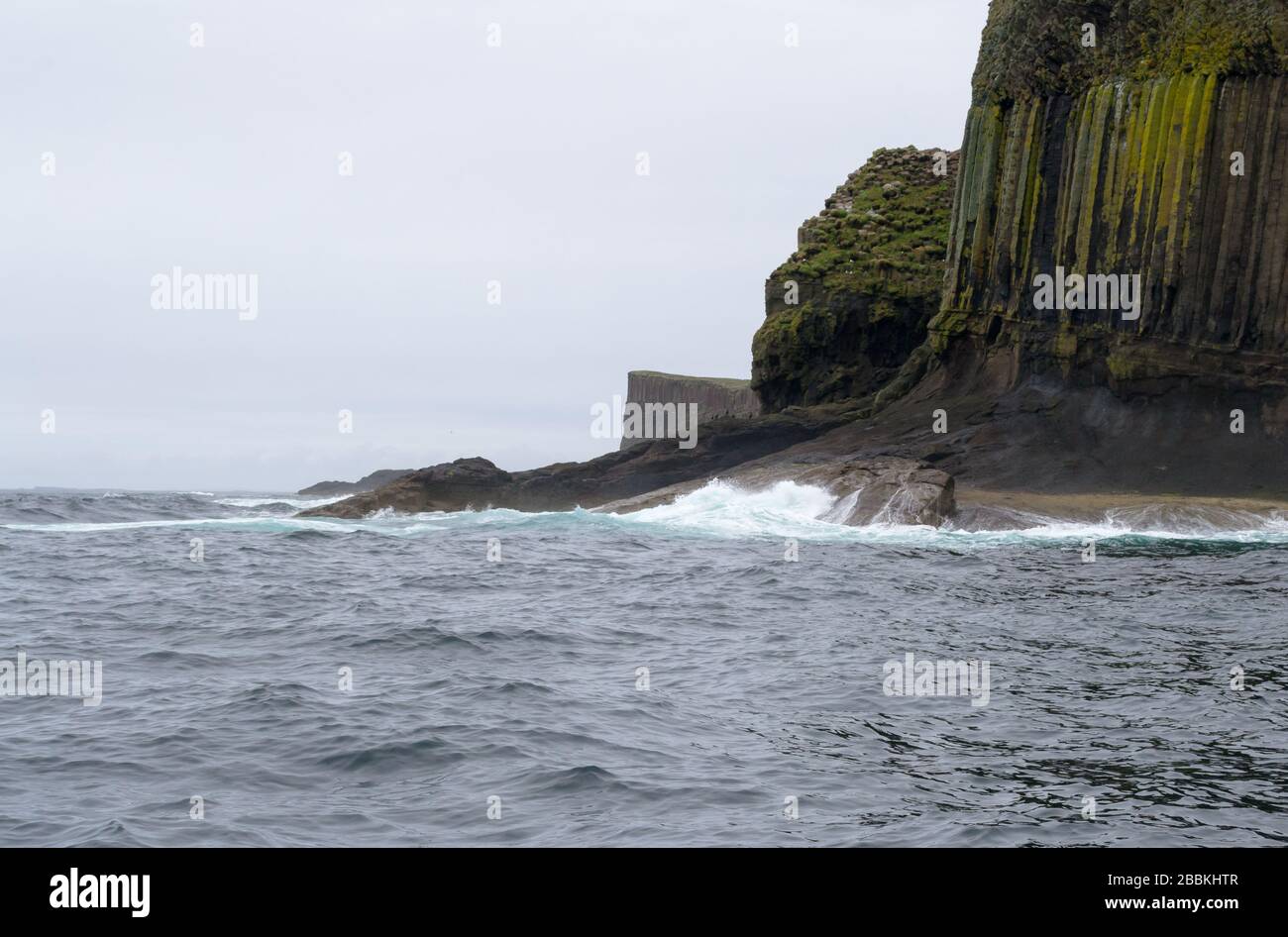 Staffa island seen from the ferry boat. It is a wild little isle closed ...