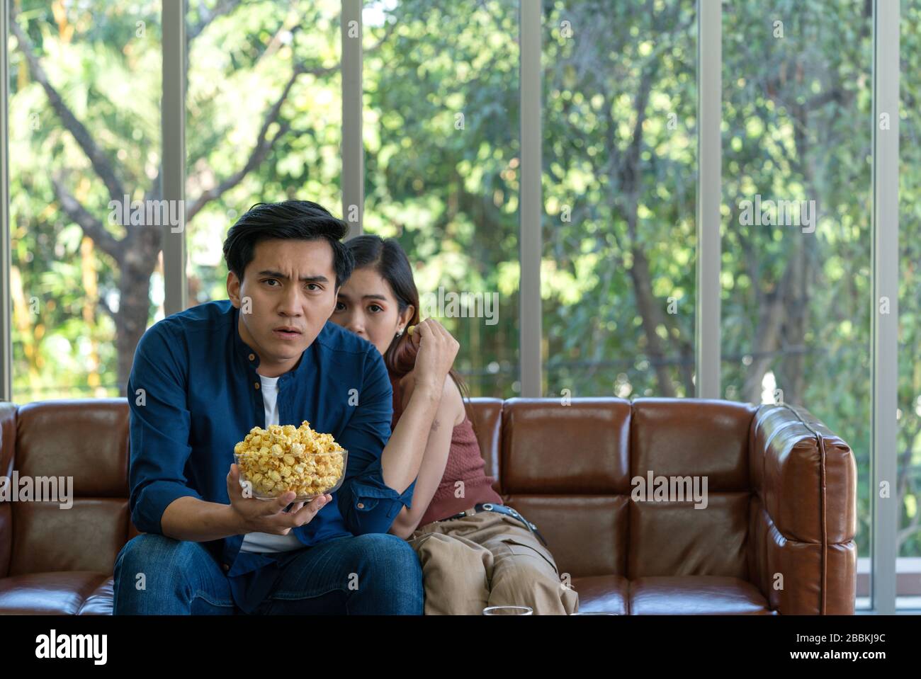 Asian watching tv horror hi-res stock photography and images - Alamy