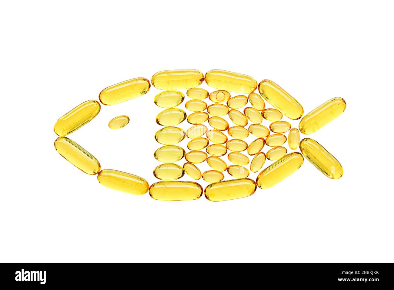 Transparent yellow medical capsules in fish shape, isolated on white ...